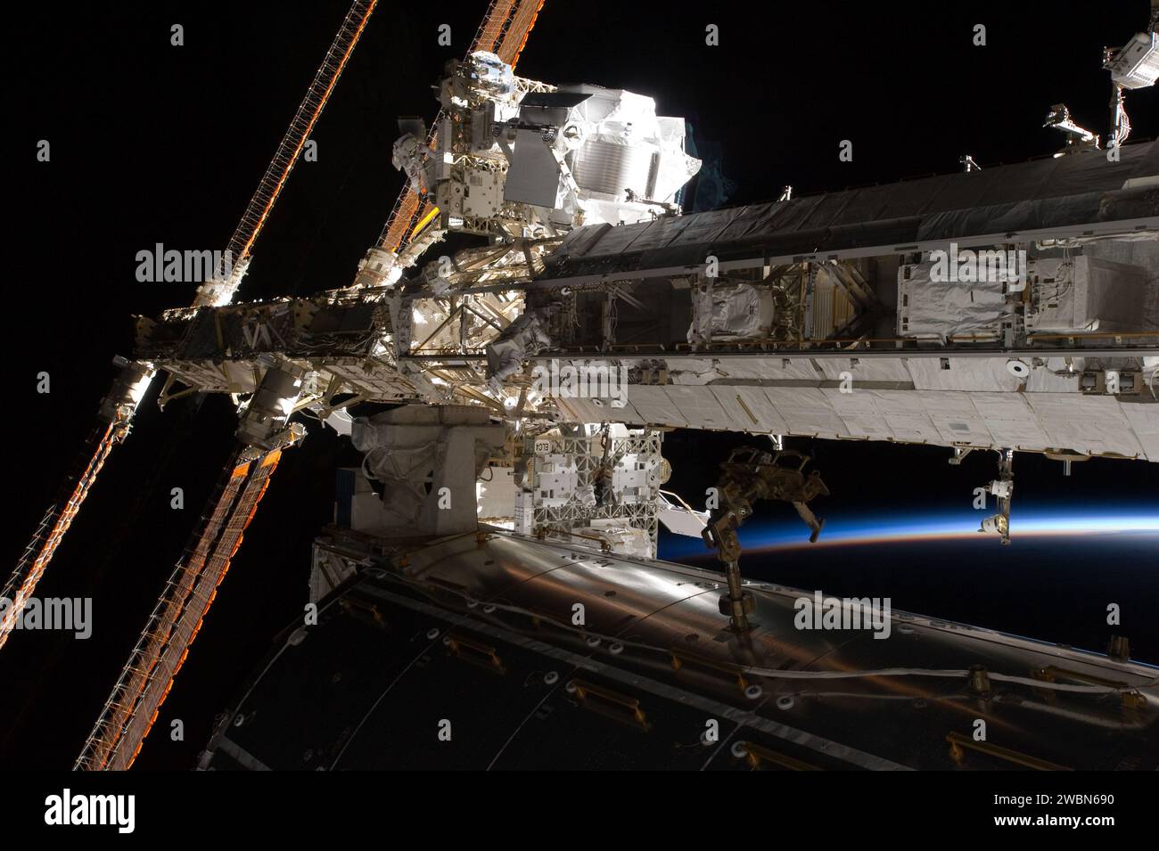 S134-E-007542 (20 May 2011) --- NASA astronauts Andrew Feustel (top ...