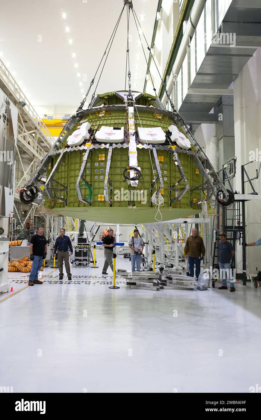 The Orion crew module for Artemis I is lifted into a test stand for ...