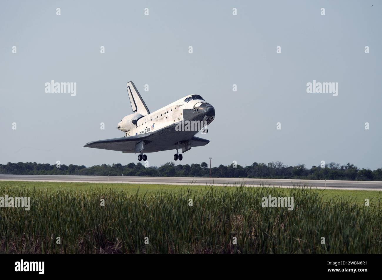 CAPE CANAVERAL, Fla. - Space shuttle Discovery appears to hover above ...