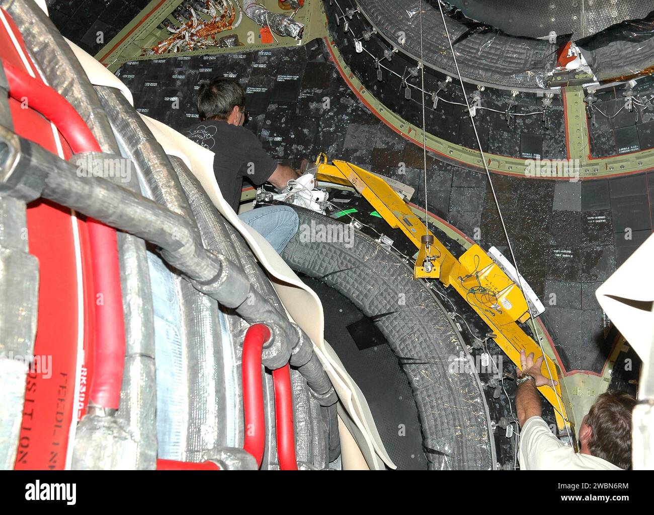KENNEDY SPACE CENTER, FLA. - Dave Fentris (upper left) and Gary Austin ...