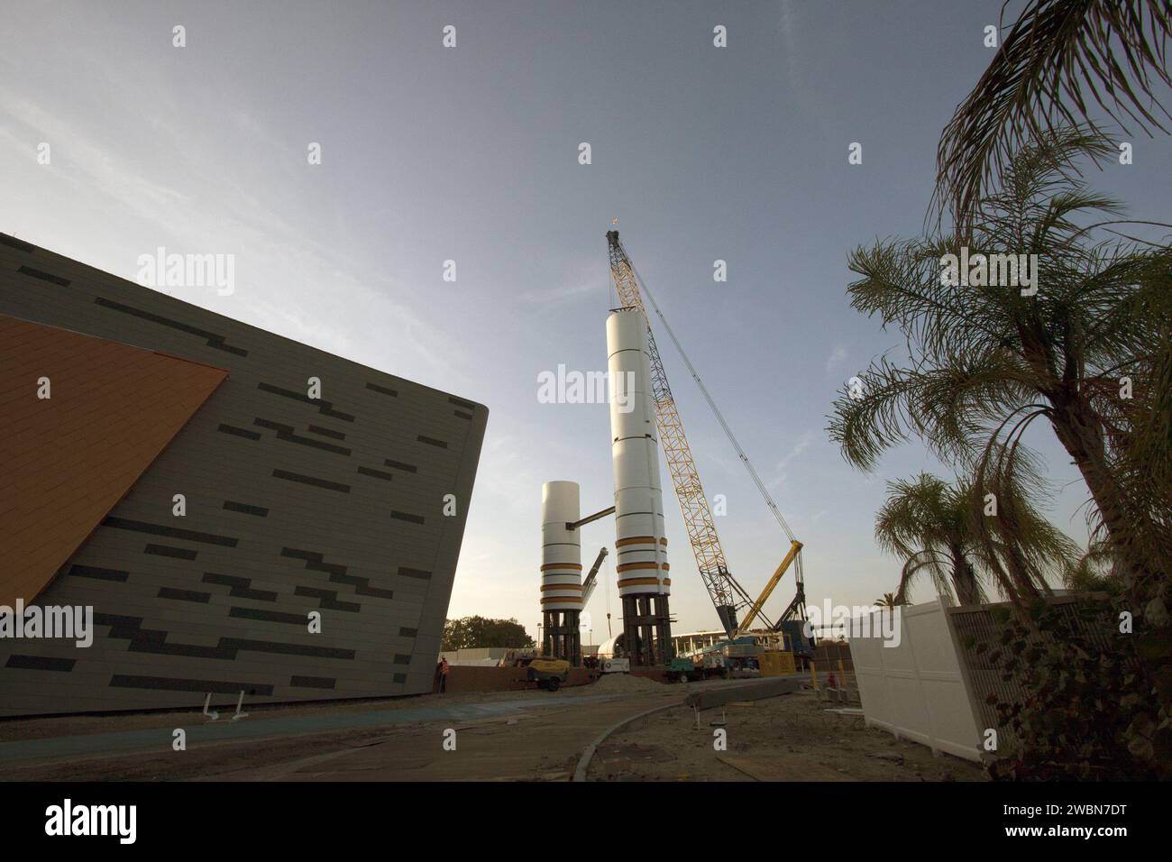 CAPE CANAVERAL, Fla. – Workers prepare to lift a segment for a set of ...