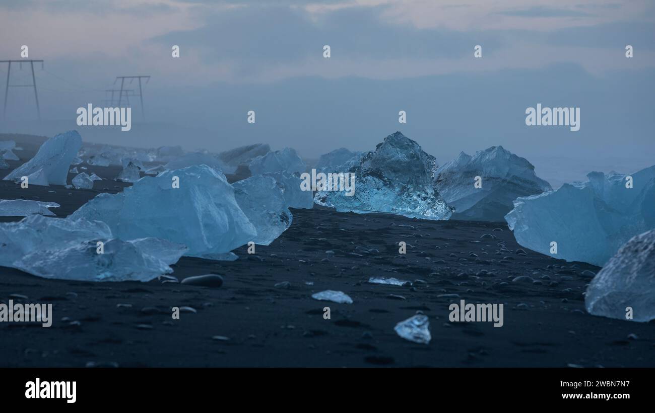 Crystal clear, blue chunks of ice on the black sand of Diamond Beach ...