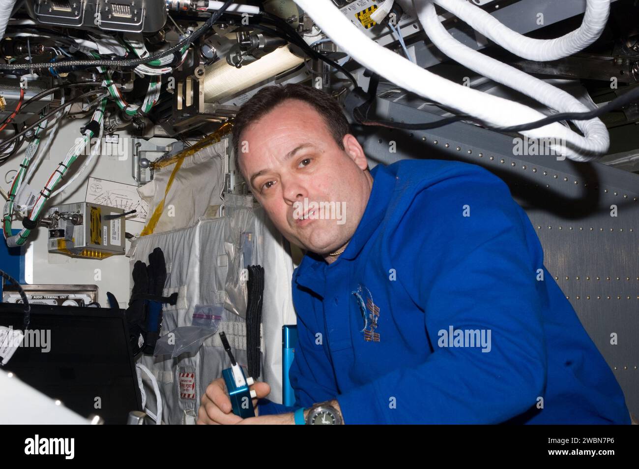 NASA astronaut Ron Garan, Expedition 28 flight engineer, works at the ...