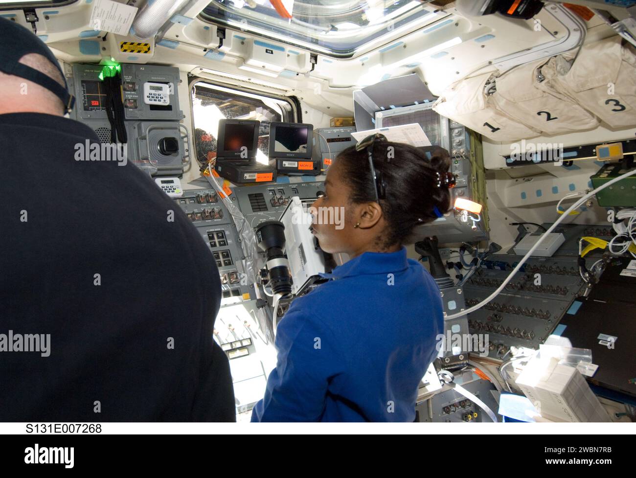 S131-E-007268 (7 April 2010) --- NASA astronauts Alan Poindexter, STS ...