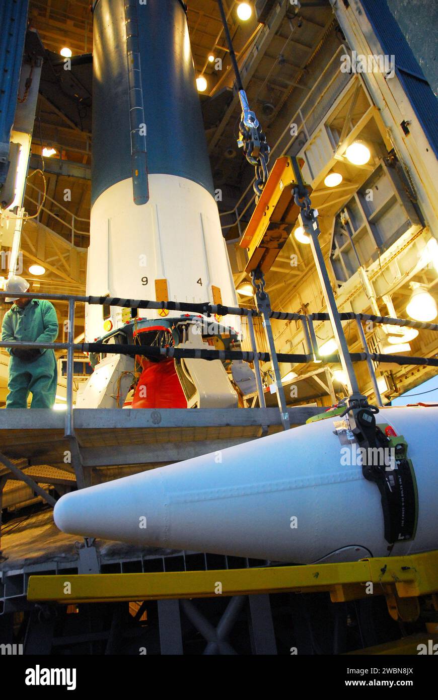 VANDENBERG AIR FORCE BASE, Calif. -- With the aid of an overhead crane workers lift one of three ...