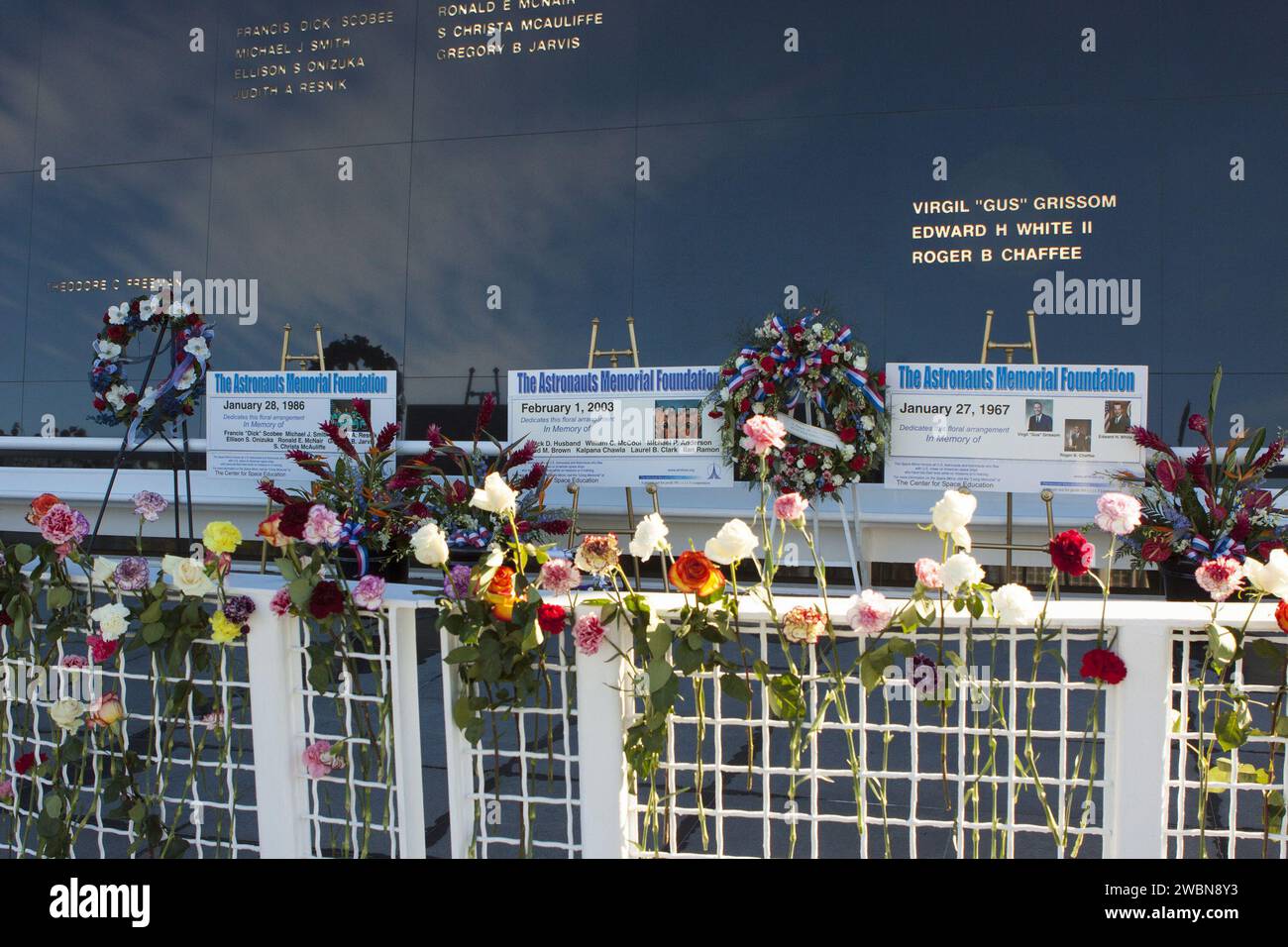 At Kennedy Space Center, employees and guests placed wreaths and ...