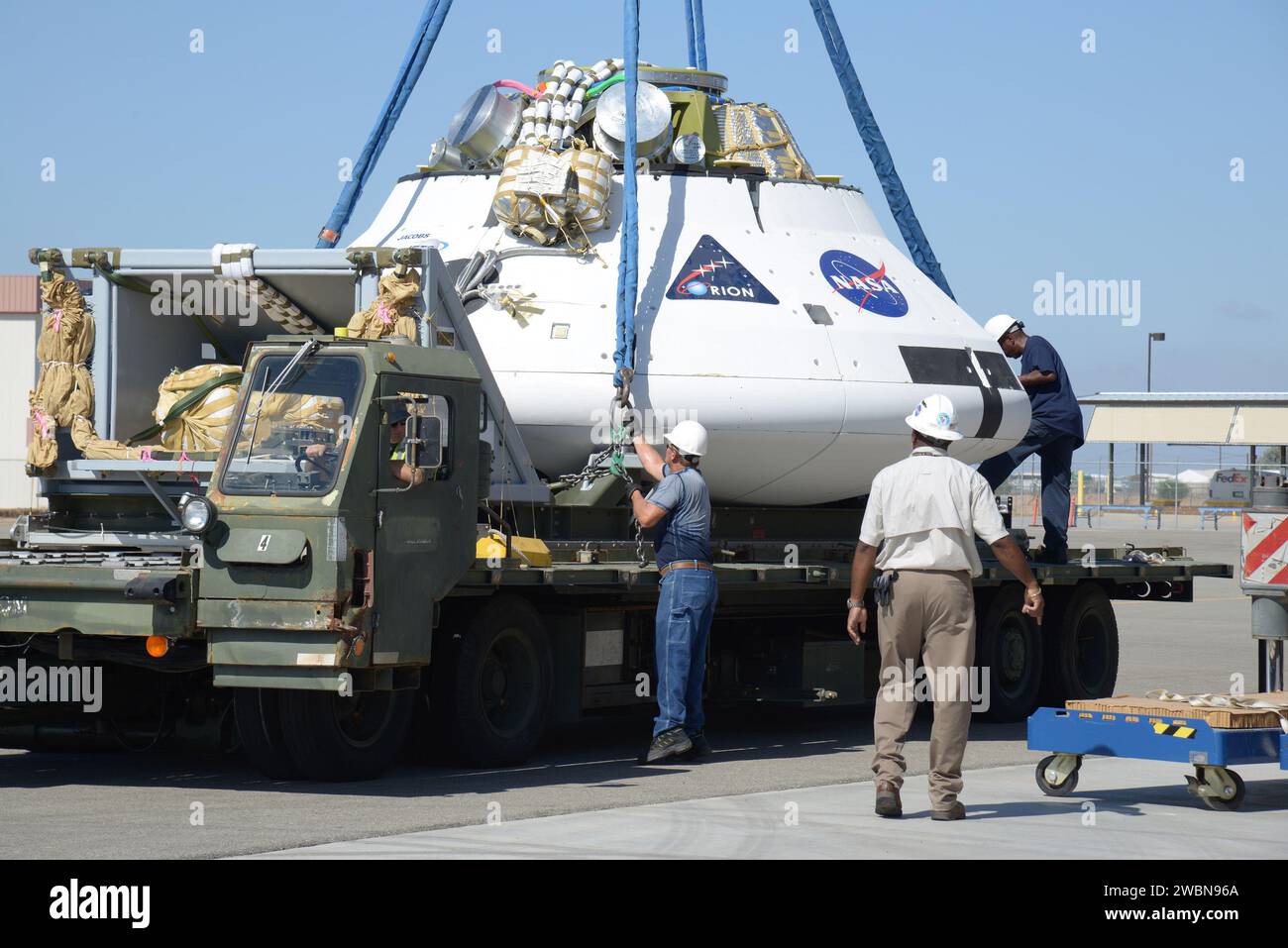 Teams peform Orion Parachute Test Vehicle (PTV) loading operations on ...