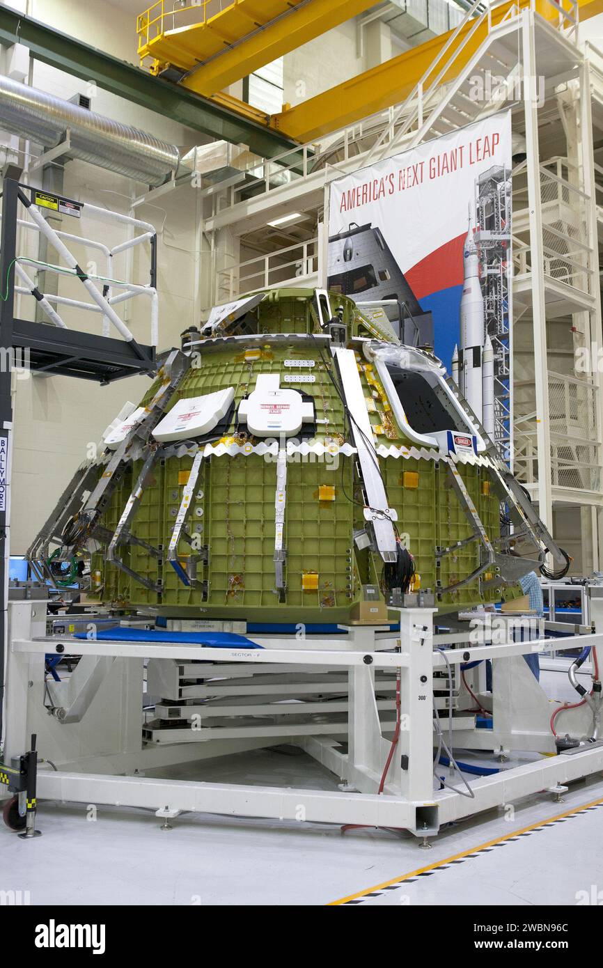 The Orion crew module for Artemis I is lifted into a test stand for ...