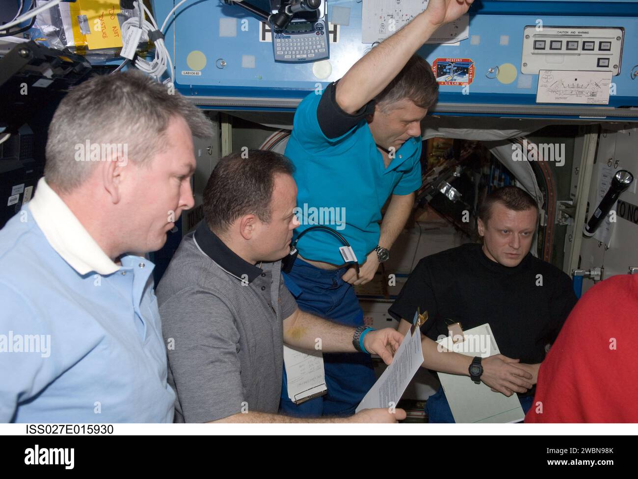 Expedition 27 crew members conduct mission activities in the Destiny ...