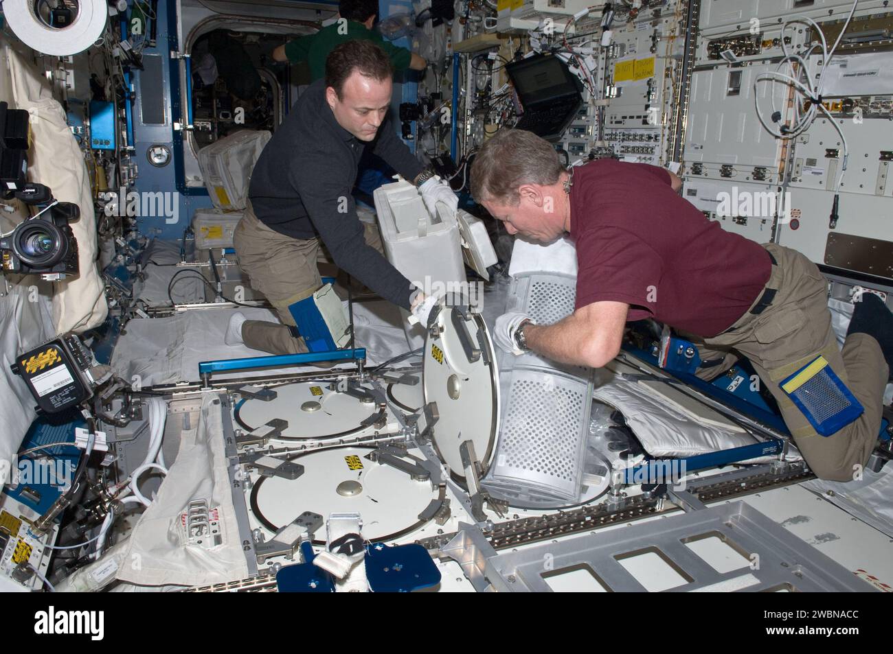 ISS028-E-014916 (8 July 2011) --- NASA astronauts Ron Garan (left) and ...