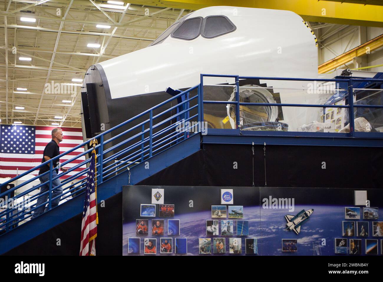 NASA astronaut Doug Hurley walks up the stairs to the Crew Compartment ...