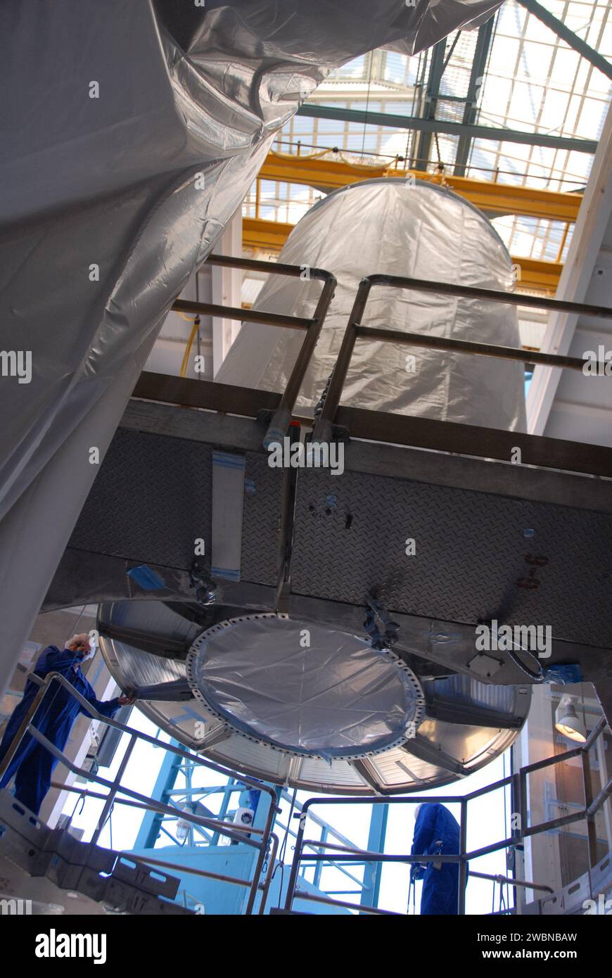 Tucked inside a protective payload transportation canister, NASA’s ...