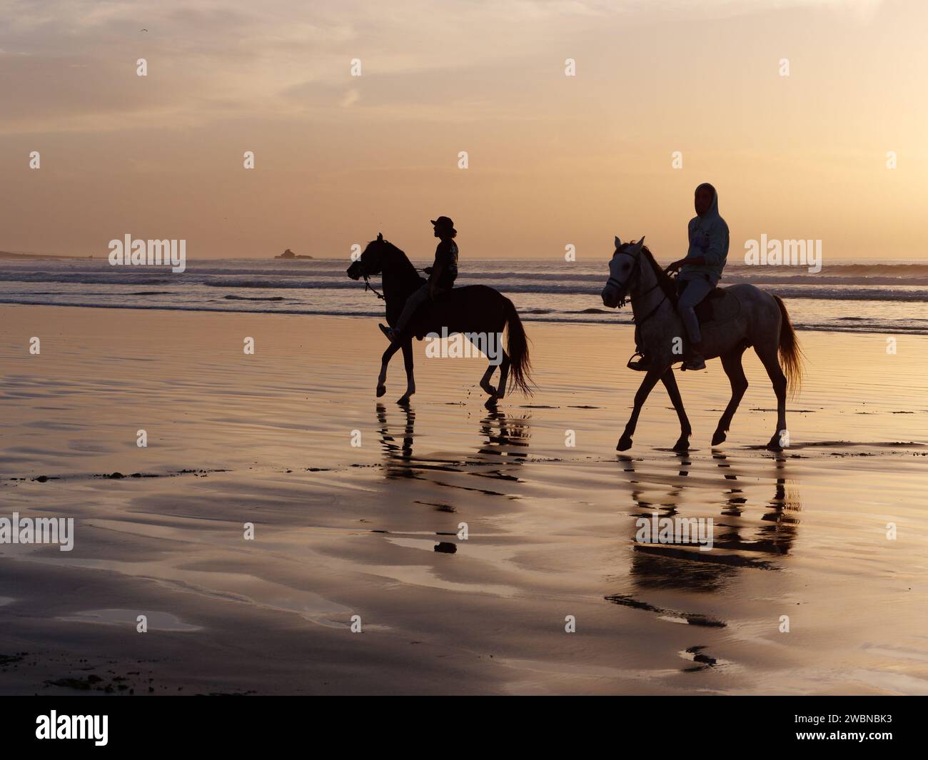 Riding horses at sunset hi-res stock photography and images - Alamy