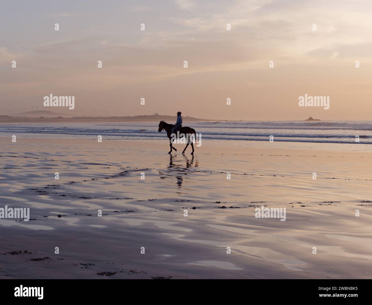 Riding horses at sunset hi-res stock photography and images - Alamy