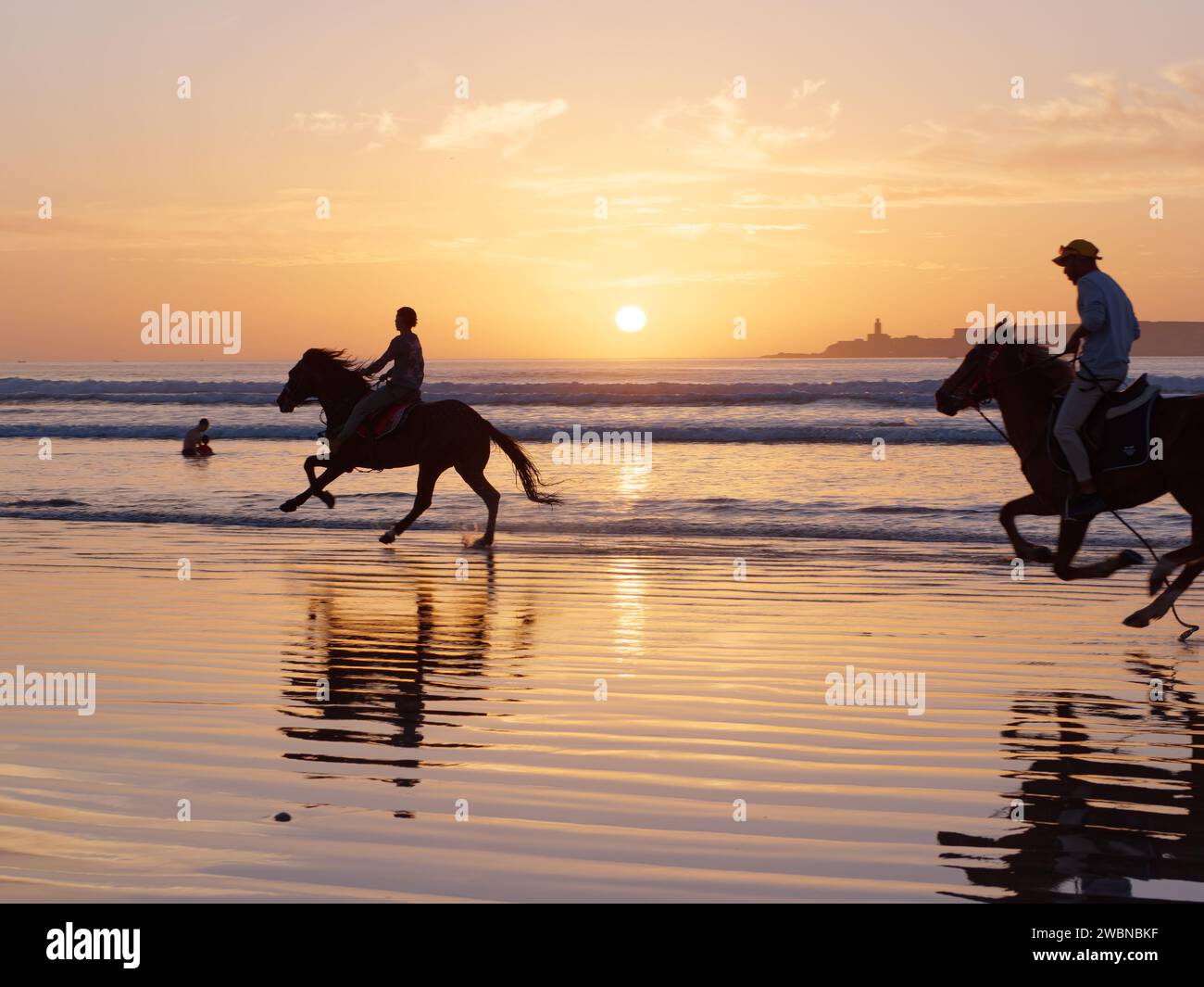 Riding horses at sunset hi-res stock photography and images - Alamy