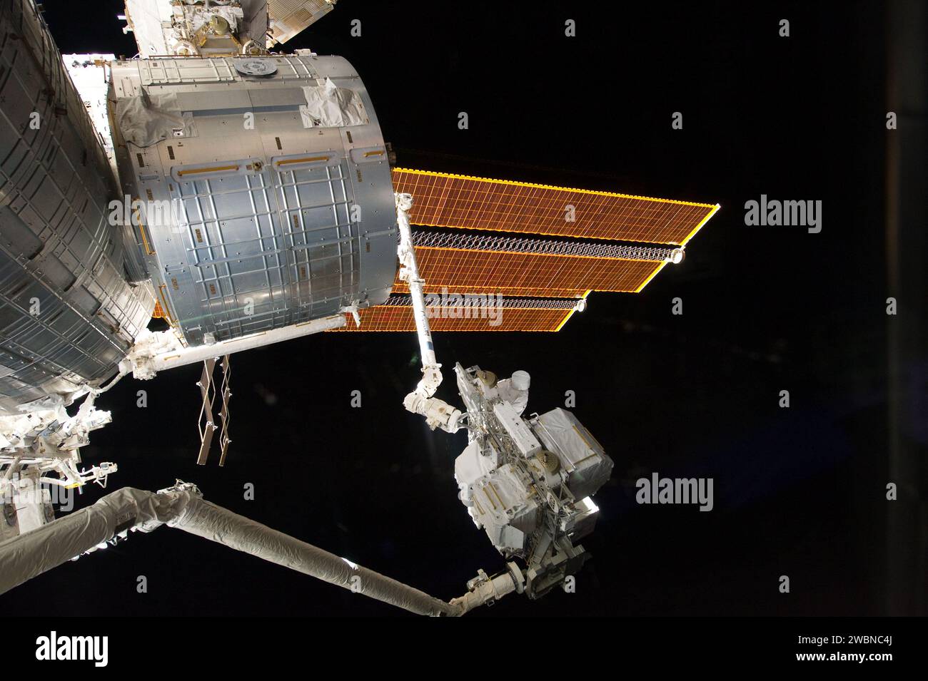 The robotic handoff between Endeavour’s Canadarm and ISS Canadarm2 of ...