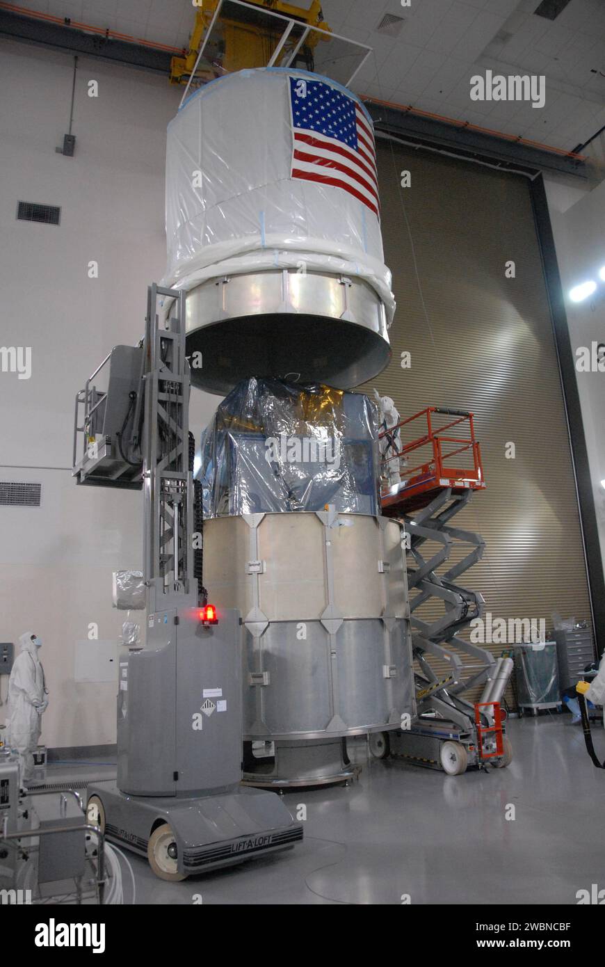 In a clean room inside the Astrotech Payload Processing Facility at ...