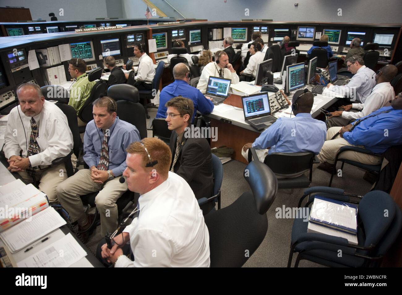 Launch controllers in Firing Room 4 at Kennedy Space Center monitor STS ...