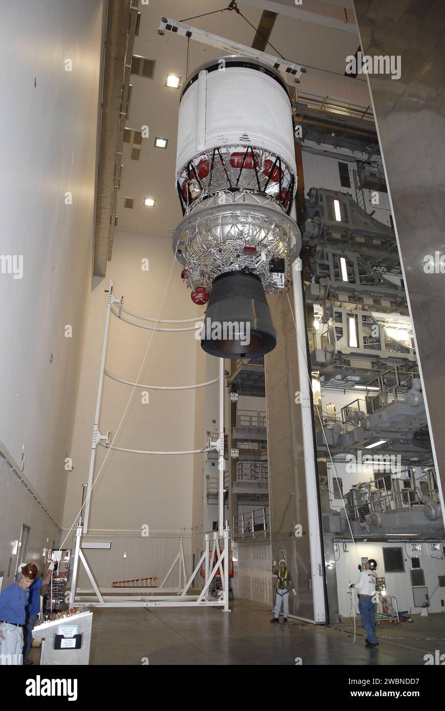 CAPE CANAVERAL, Fla. – Workers lower the second stage of a Delta IV ...