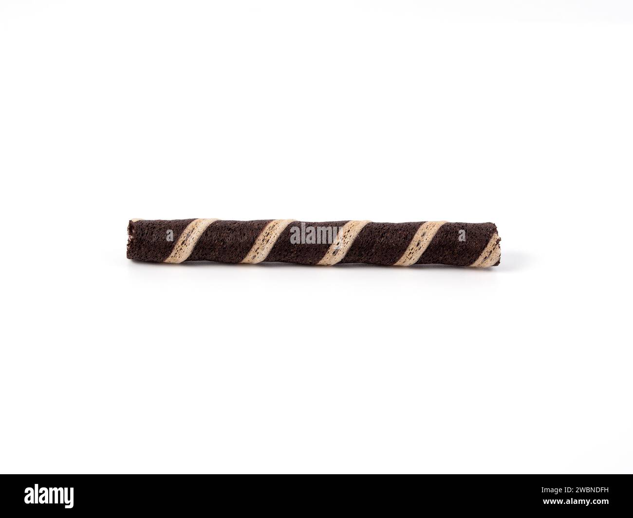 Crispy waffle rolls on a white background. Black and white wafer rolls ...