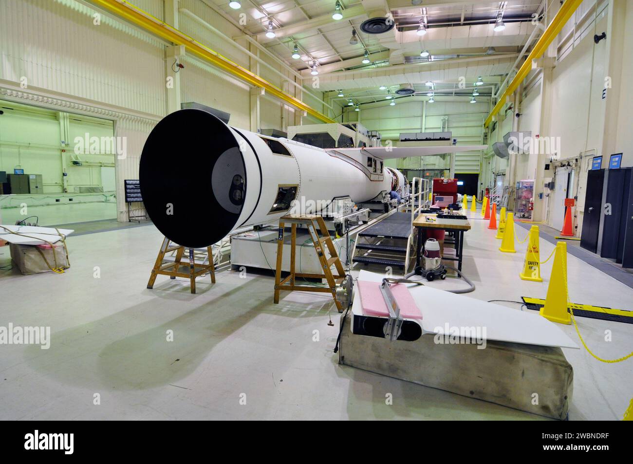 Technicians install fins on the aft end of Stage 1 of the Pegasus ...