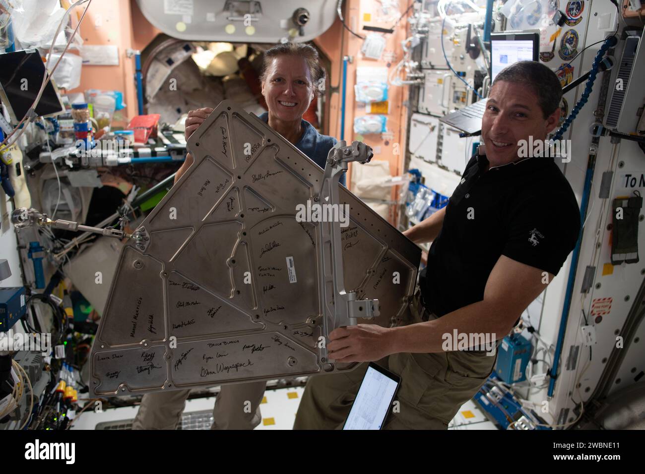 NASA astronauts Shannon Walker and Michael Hopkins install components ...