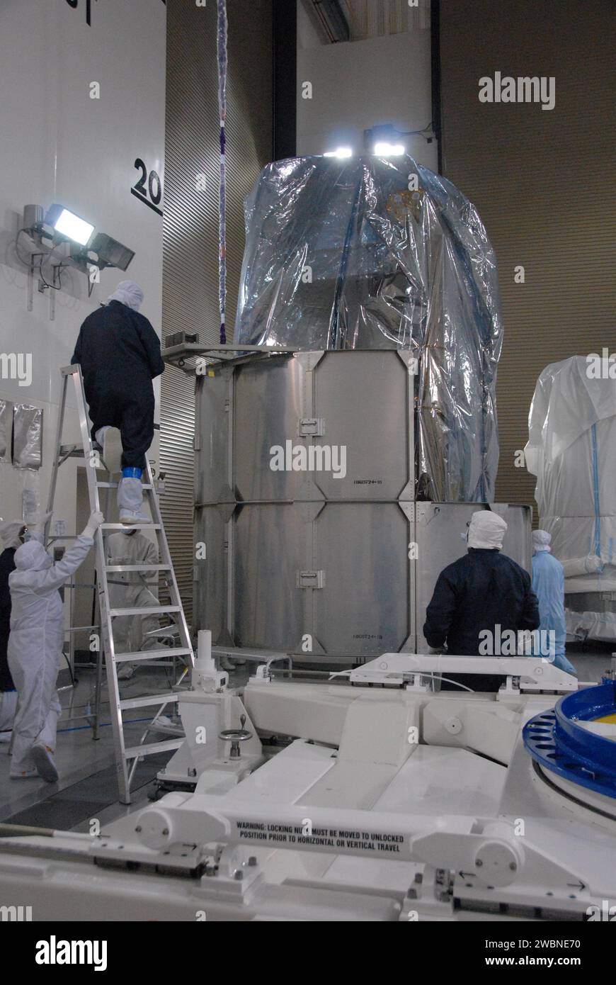 In a clean room inside the Astrotech Payload Processing Facility at ...