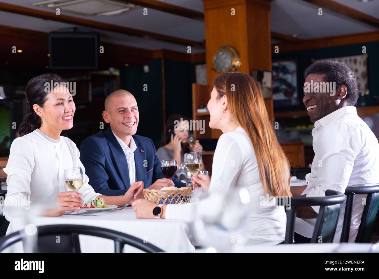 positive clients eating and drinking in cafe Stock Photo - Alamy
