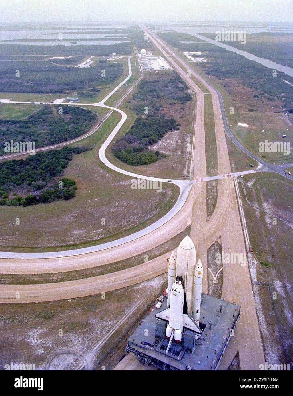 STS-1 Columbia, with external tank and twin solid rocket boosters, is ...