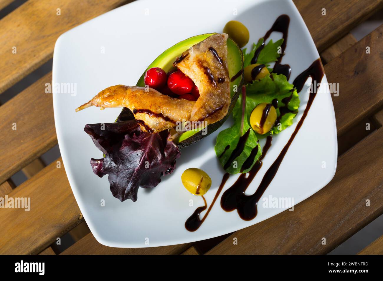 Delicious fried legs of quail with balsamic pasta, avocado and greens ...