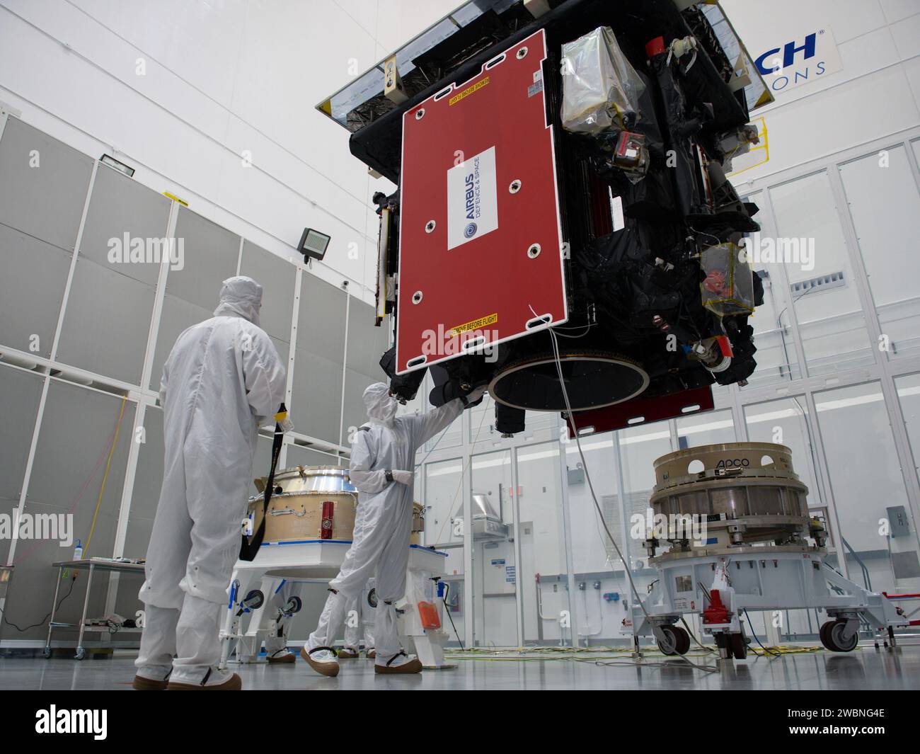The Solar Orbiter spacecraft is moved by crane from a work stand to the ...
