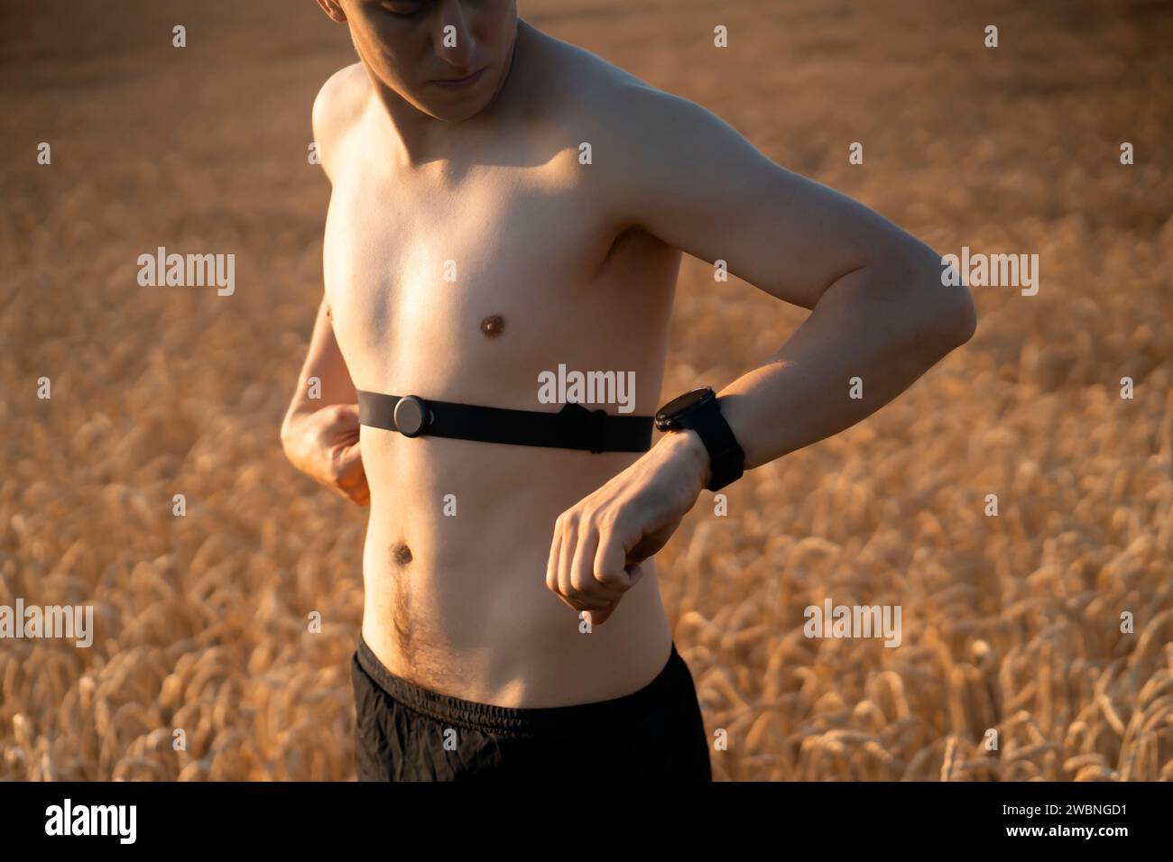 Man is wearing a heart rate monitor before his run and jog training ...