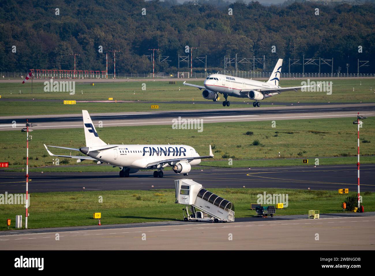 Düsseldorf Airport, Aegean Air Airbus A320 on landing, Finnair aircraft ...