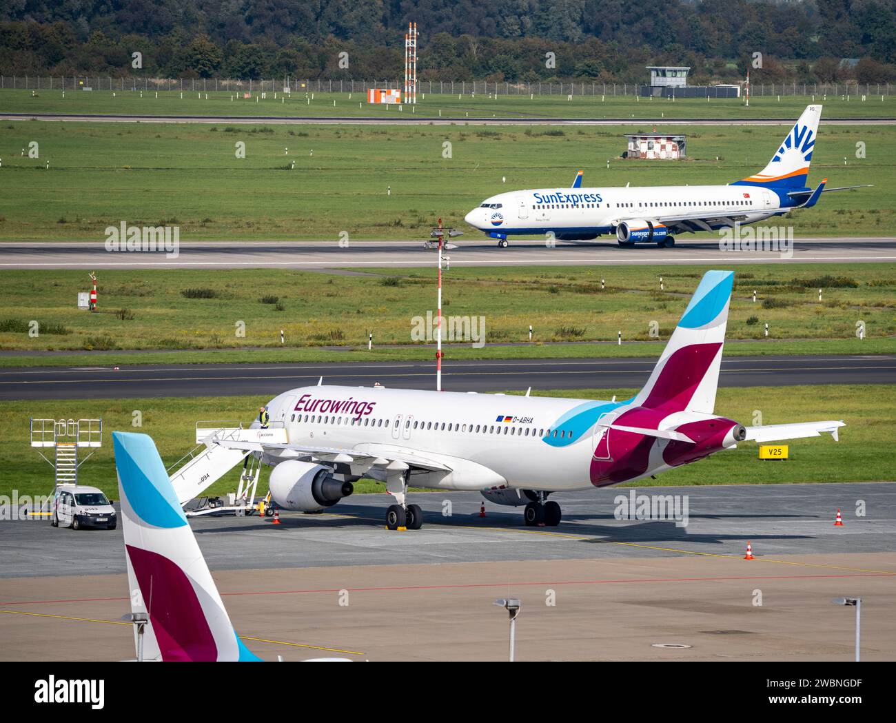 Düsseldorf Airport, SunExpress Boeing 737 on landing, Eurowings Airbus ...