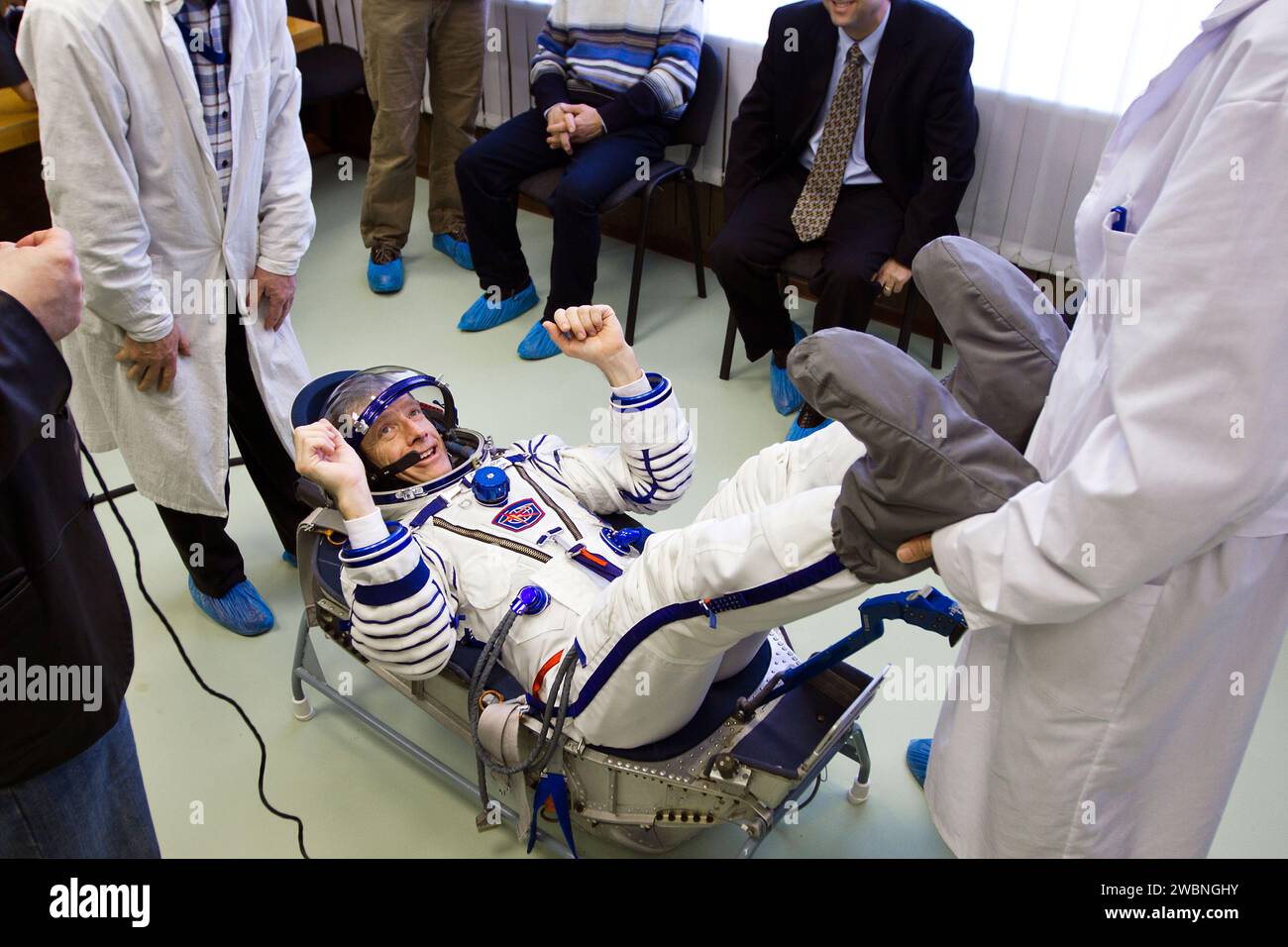 NASA astronaut Chris Ferguson undergoes a fit check of his Sokol space ...