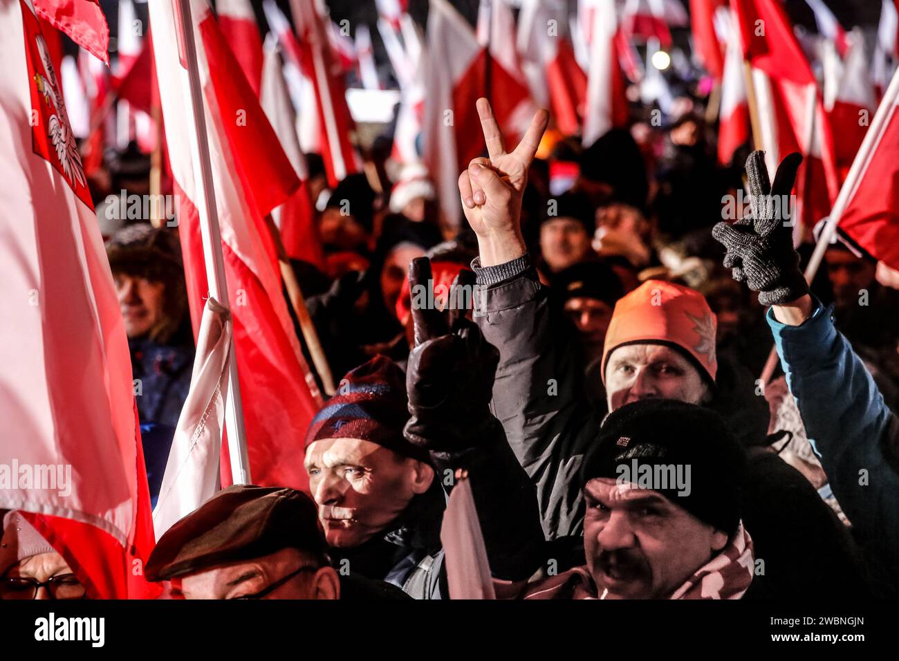 Warsaw, Poland, 11th of January 2024. Crowds of people, holding Polish ...