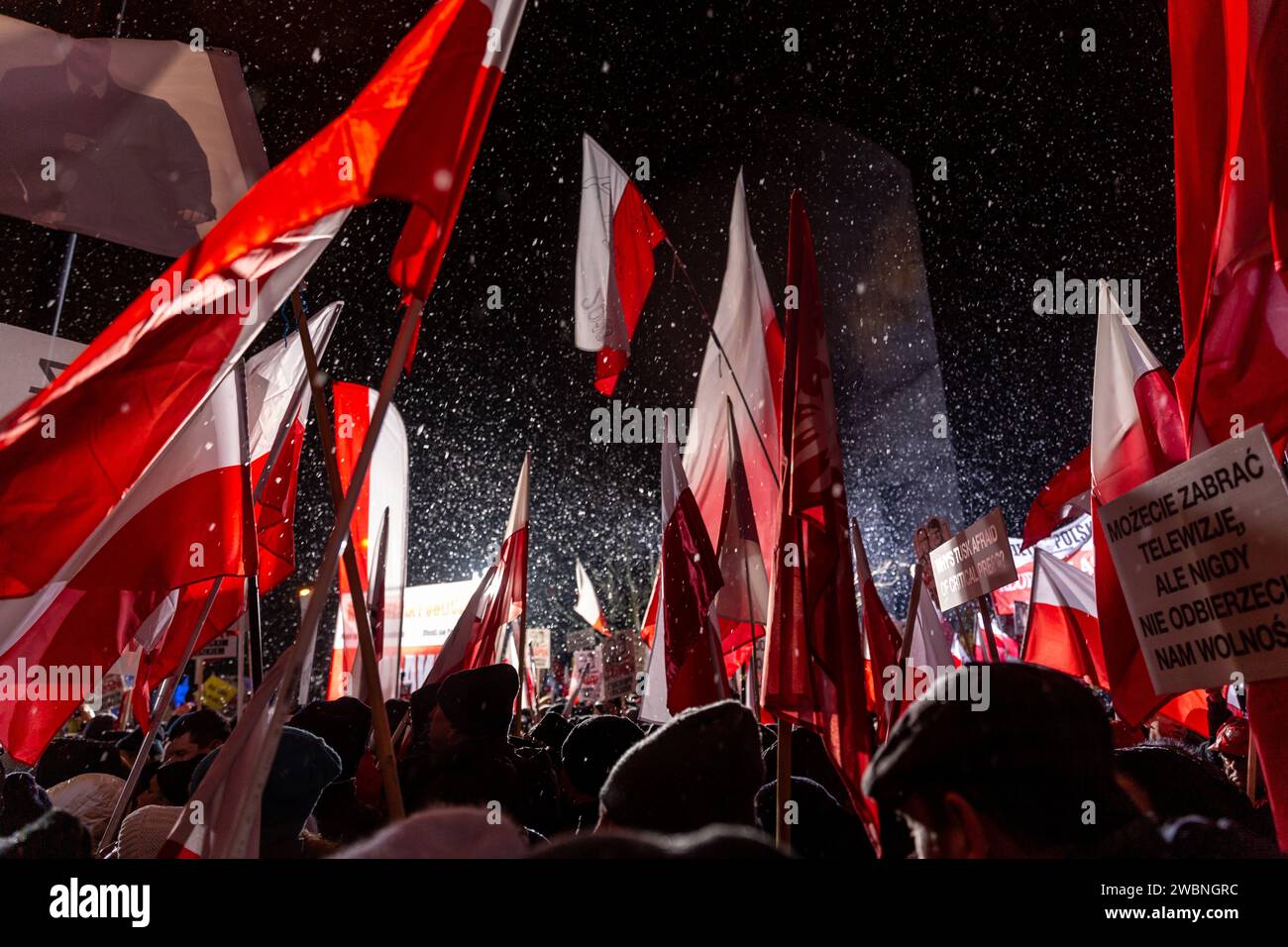 Warsaw, Poland, 11th of January 2024. Crowds of people, holding Polish ...