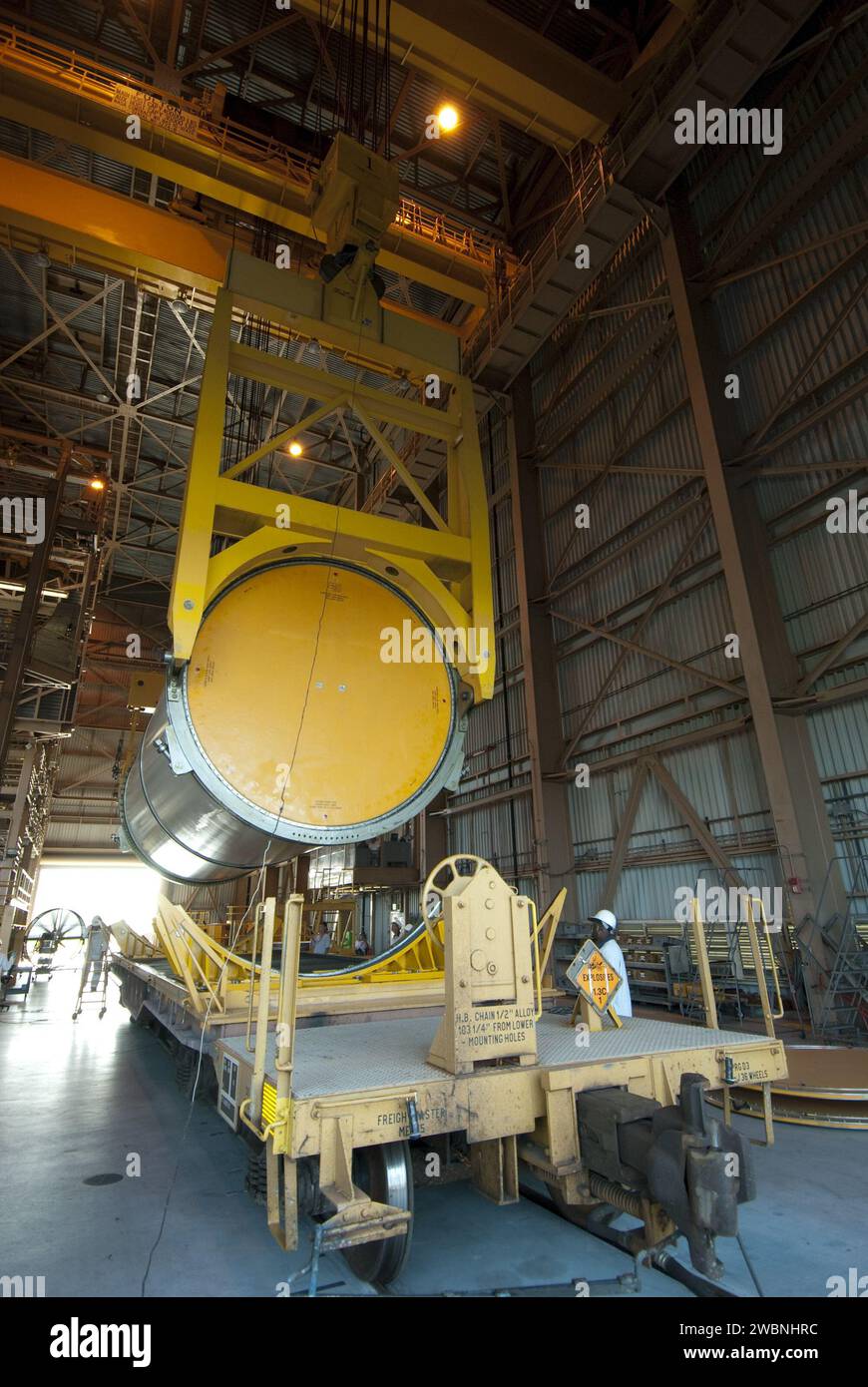 CAPE CANAVERAL, Fla. -- Twin cranes hoist the first solid rocket ...