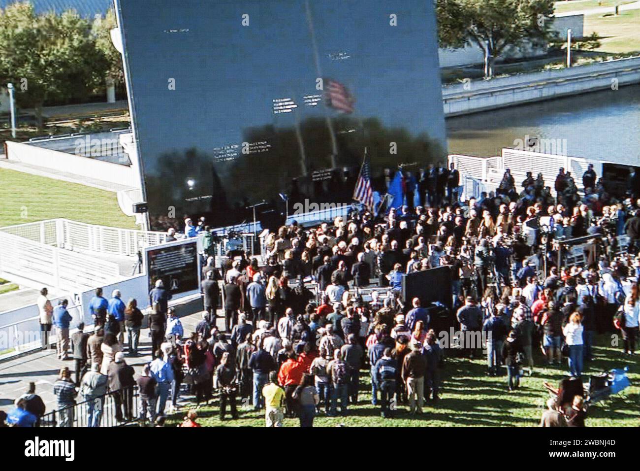CAPE CANAVERAL, Fla. -- Kennedy Space Center employees and guests stand ...