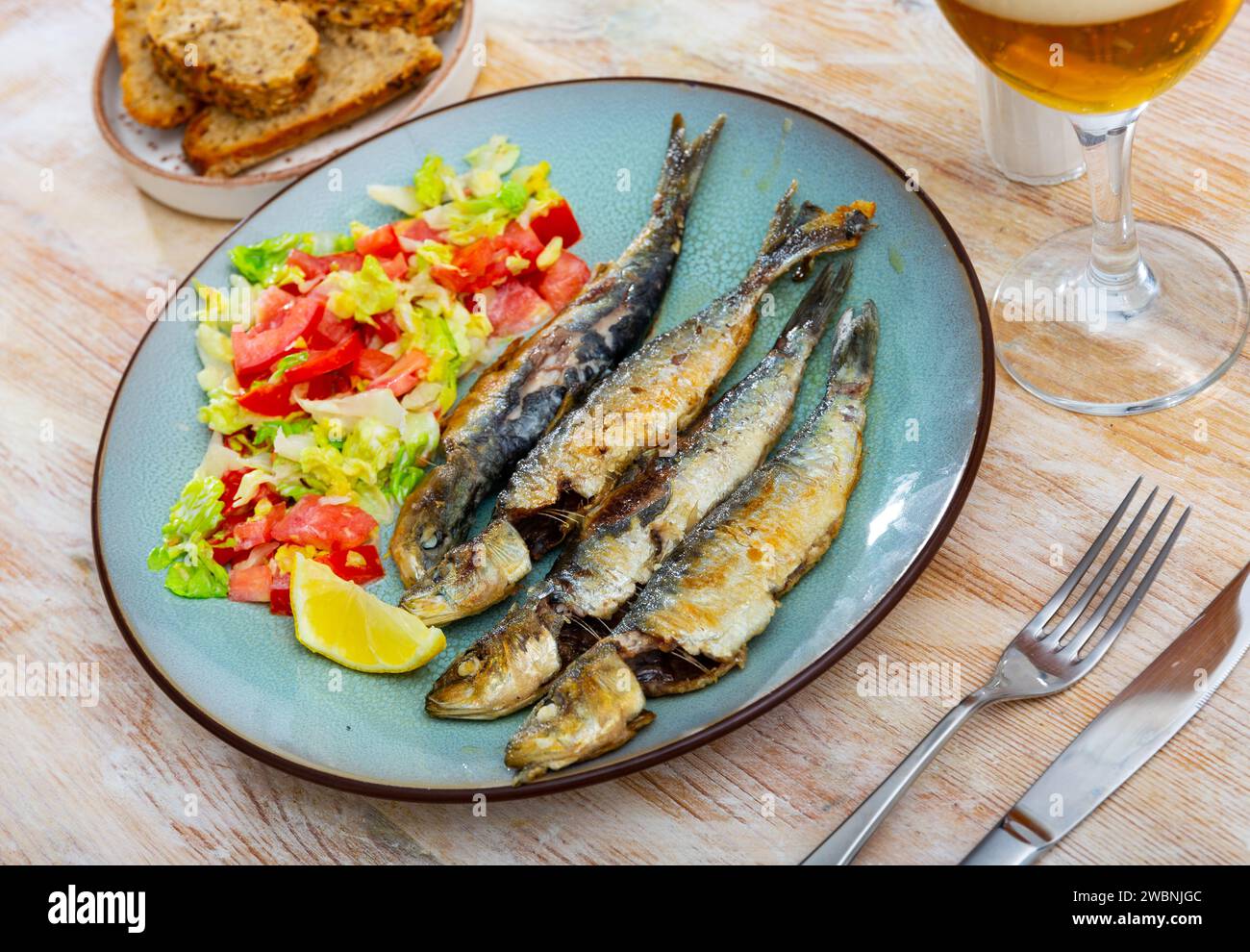 Fried sardines served on table Stock Photo - Alamy