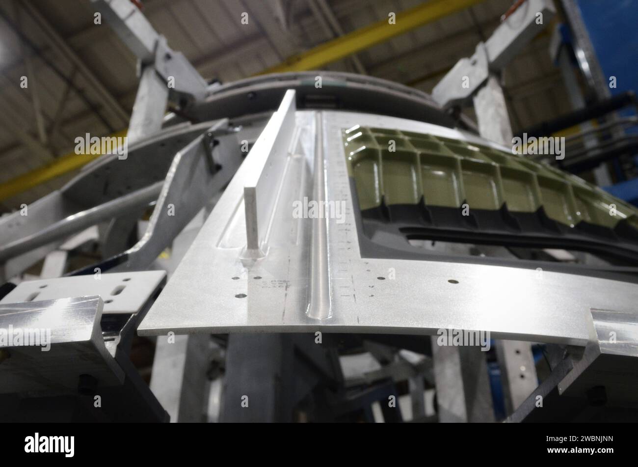Technicians begin welding the Exploration Flight Test-1 (EFT-1) Orion ...