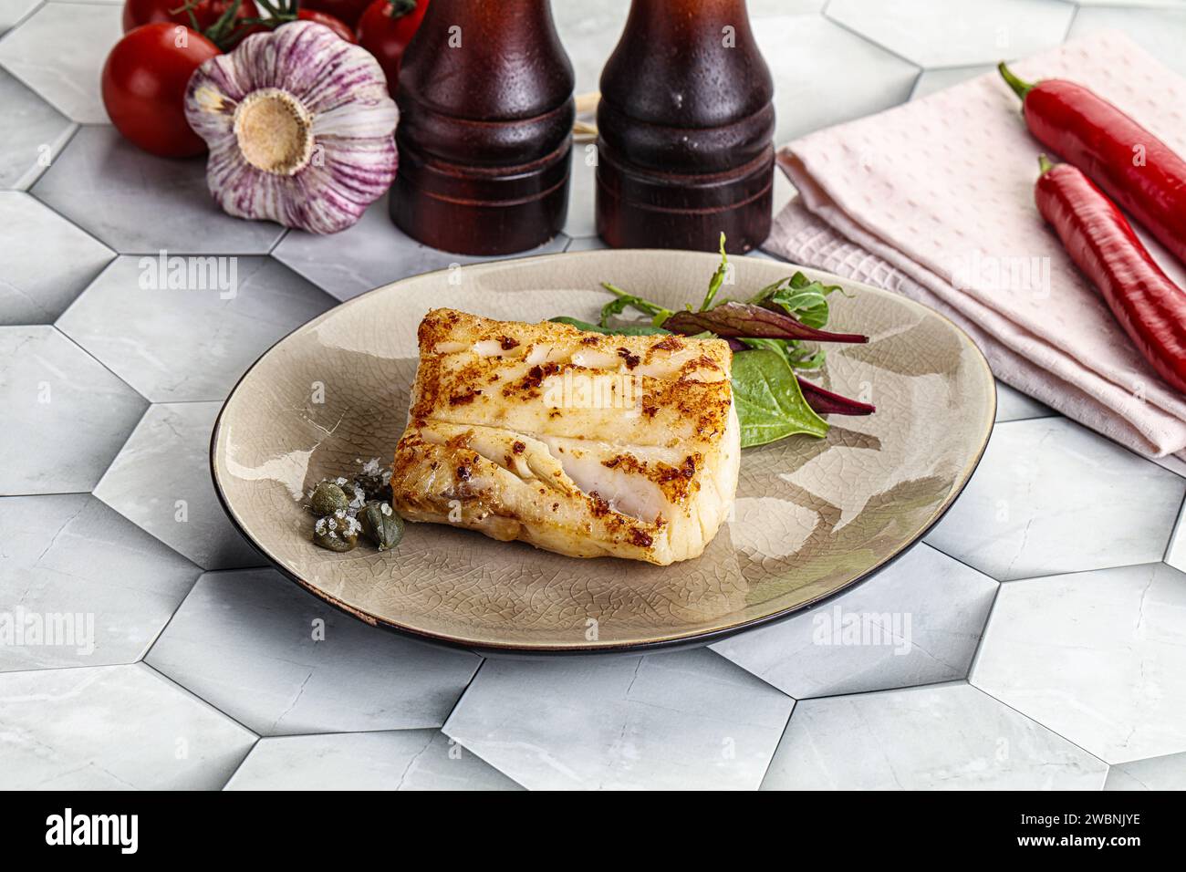 Roasted cod fish steak with salad leaves Stock Photo - Alamy