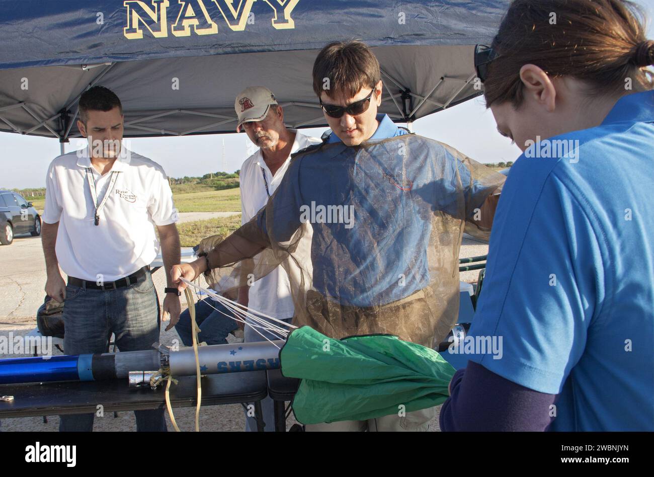 Engineers at Kennedy Space Center prepared a parachute for a small ...