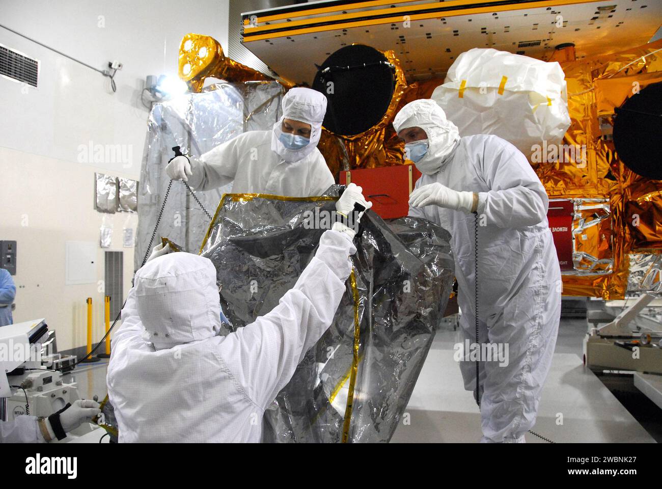 In a clean room inside the Astrotech Payload Processing Facility at ...
