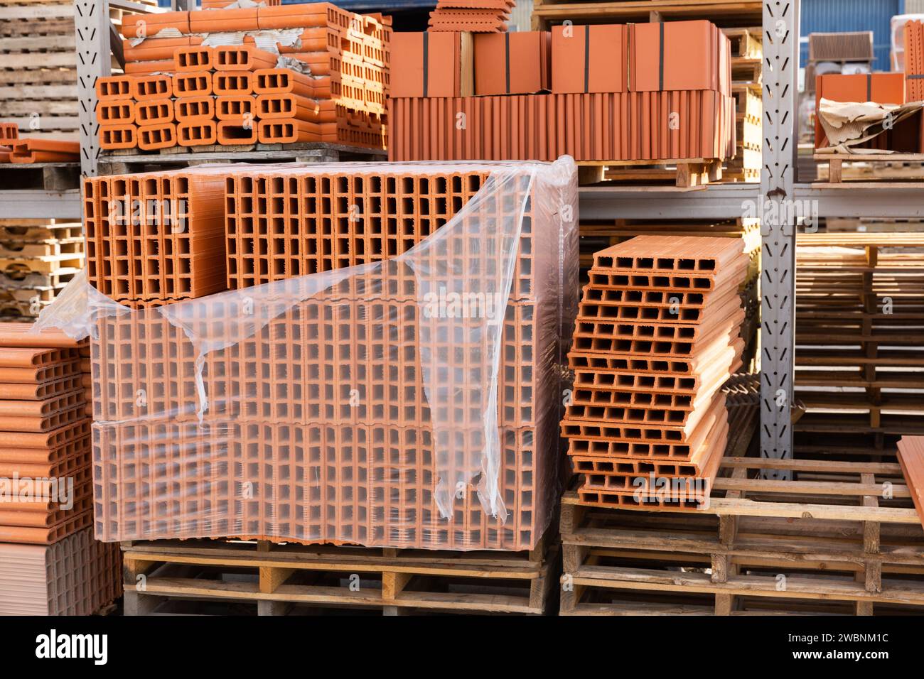 Pallets with bricks in a warehouse of brick factory Stock Photo - Alamy