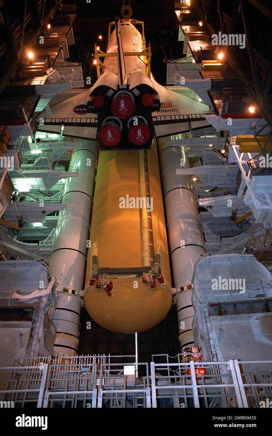 Atlantis is lowered in Vehicle Assembly Building high bay 1 for mating ...