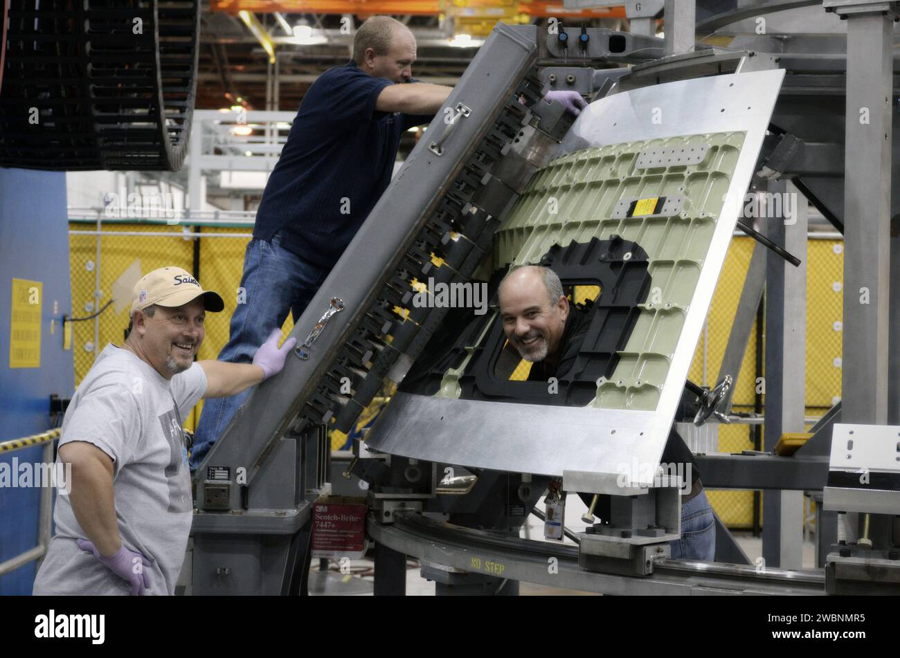 Technicians begin welding the Exploration Flight Test-1 (EFT-1) Orion ...