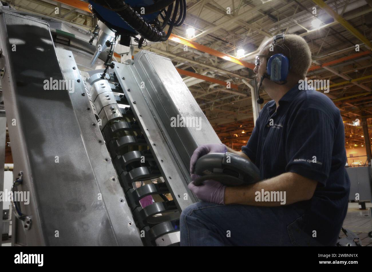 Technicians begin welding the Exploration Flight Test-1 (EFT-1) Orion ...