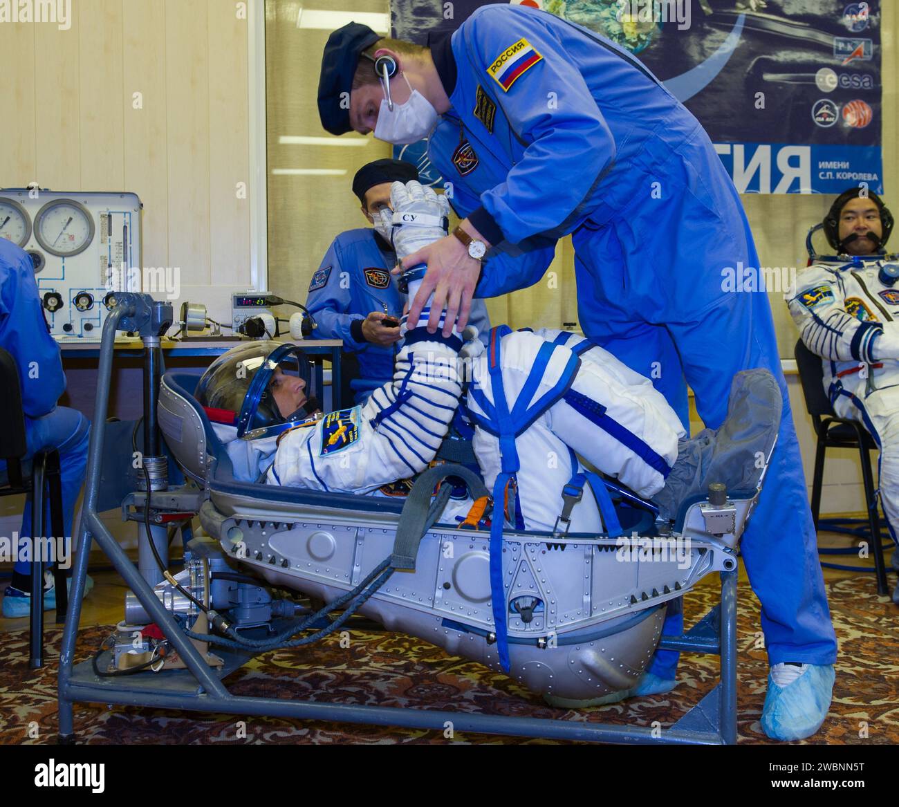 Expedition 32 NASA Flight Engineer Sunita Williams lies in a chair to ...
