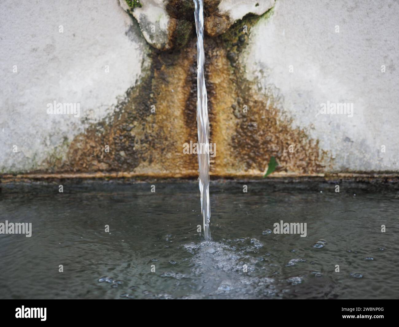 Water Jet Of An Ancient Stone Fountain Stock Photo - Alamy